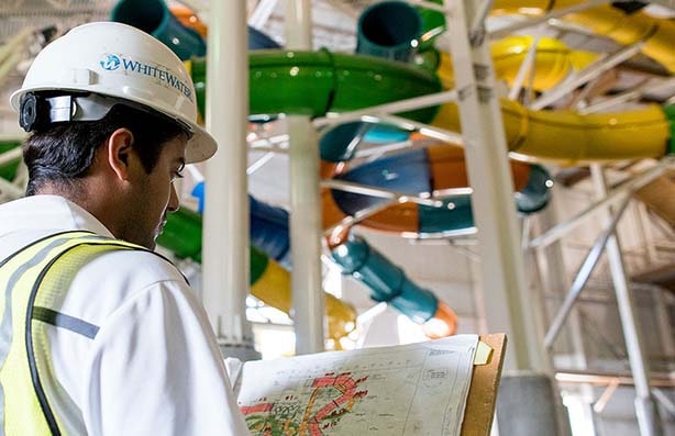 Manufacturing, engineering, installing, testing attractions for parks